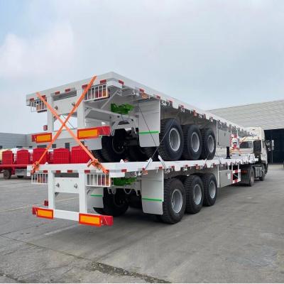 China 3 ejes 40FT 20FT remolque de cama plana con contenedor de bloqueo Jost dos velocidades de apoyo pierna en venta