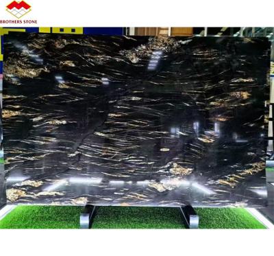 Cina Piuma di Fenice Naturale Moderna Oro Nero Pietra di Marmo Scale Piastra Piastrella Grandi lastre in vendita