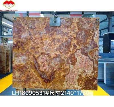 Cina Marmo di onice rosso tigre naturale trasparente lucidato per il design dell'hotel di giada retroilluminato moderno in vendita