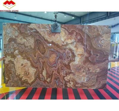 Cina Marmo di onice rosso tigre naturale trasparente lucidato per il design dell'hotel di giada retroilluminato moderno in vendita