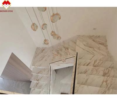 China Customized Size Venus Gold Calacatta Marble Spiral Staircase Tread Indoor Modern LED Light and Anti-Slip Design for sale