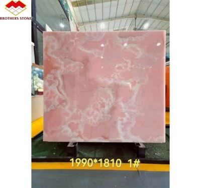 Cina Pietra naturale retroilluminata rosa onice lastra di pietra traslucida per tavolo moderno e batutub in vendita