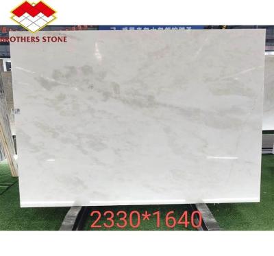 China Modern Royal White Onyx Honed Marble Sheet Cut-to-Size Graphic Design Solution for Wall Panel and Dining Table Set for sale