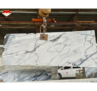 Cina Snow Mountain Bianco Marmo Grandi lastre per il design moderno Tavolo da pranzo Top pietra naturale in vendita