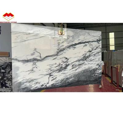 Cina Snow Mountain Bianco Marmo Grandi lastre per il design moderno Tavolo da pranzo Top pietra naturale in vendita
