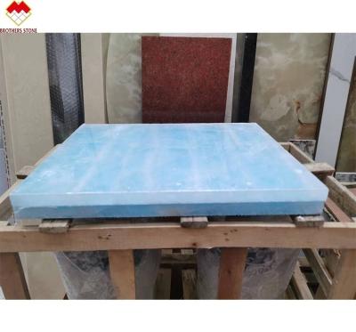 China Prachtige achtergrondverlichting Blauwe kristal Onyx plaat Perfect voor moderne woning en hotel decor Te koop