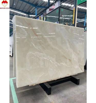 China La placa de mármol de ónix blanco real con luz de fondo para mesa personalizable, encimera y panel de pared en venta