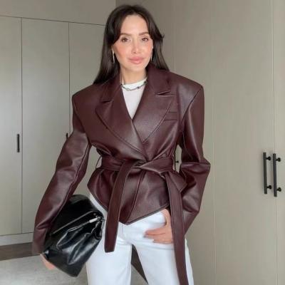 China Women's Premium Faux Leather Blazer Jacket with Adjustable Waist Belt and Long Sleeves for sale