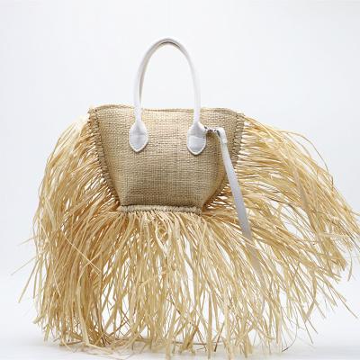 China New summer stylish handmade woven beach bag women lady long raffia tassel mini straw handbags handmade woven beach bag for sale