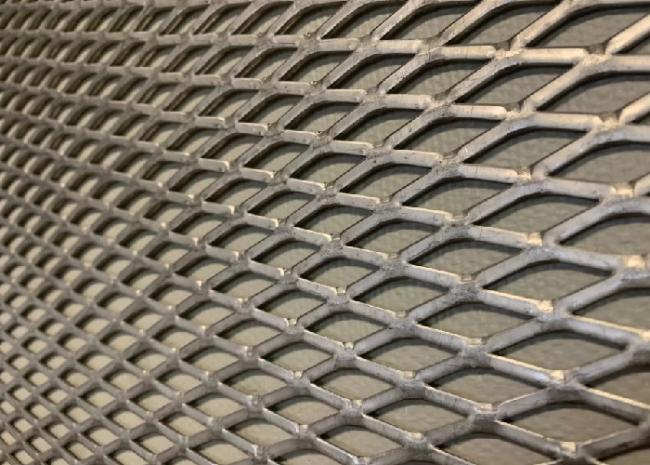 Close-up view of expanded metal mesh with uniform openings