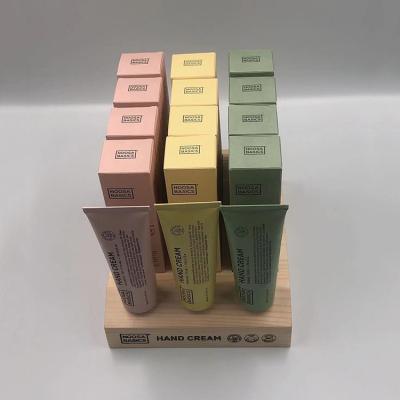 Cina Banco di mostra cosmetico della crema per le mani del supporto dell'esposizione di legno del deposito in vendita