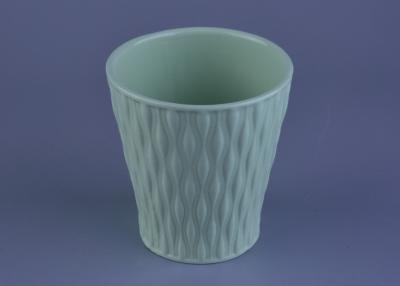 China Castiçal cerâmico vitrificado verde gravado para a decoração home do casamento à venda