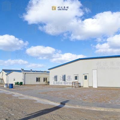 China Prefab Hunting Camp Prefabricated Steel Frame Steel Door Warehouse Building Flat Roof for sale