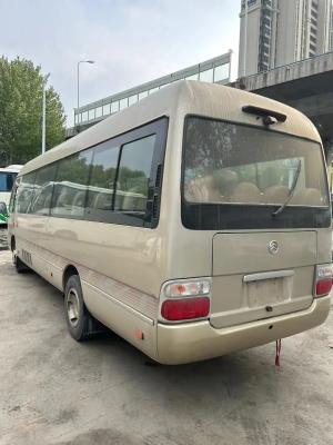 中国 XML6770 28人座 7.7メートル ゴールデンドラゴン 中古バス シャンパン ゴールド フロントエンジン 販売のため
