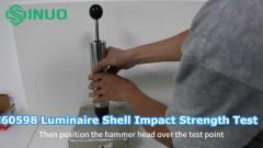 How do you test IEC 60598-1 luminaire shell impact strength?
