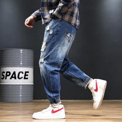 Cina Pantaloni a nove punte Haren in poliestere con logo personalizzato Jeans blu scuro larghi in vendita