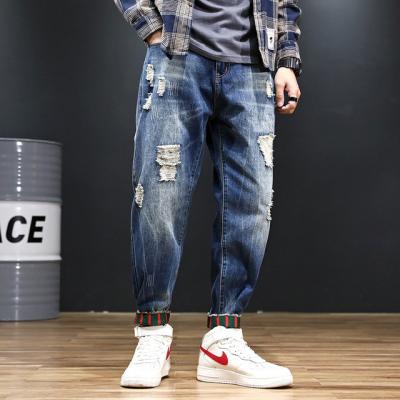 Cina Pantaloni a nove punte Haren in poliestere con logo personalizzato Jeans blu scuro larghi in vendita