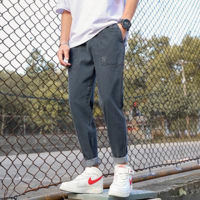 Cina Il denim degli uomini dell'harem dell'estate della primavera ansima i jeans della vita del cordone con le grandi tasche in vendita