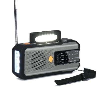 China New Portable OEM Factory Solar Crank Dynamo Flashlight & Reading Lamp Radio with AM FM WB Band for Emergency Survival for sale