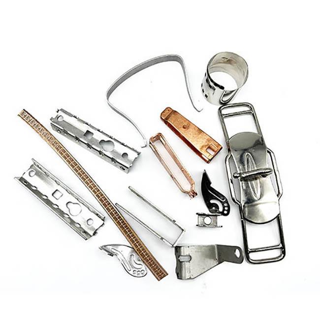 Precision laser cut metal parts showing clean edges and complex geometries