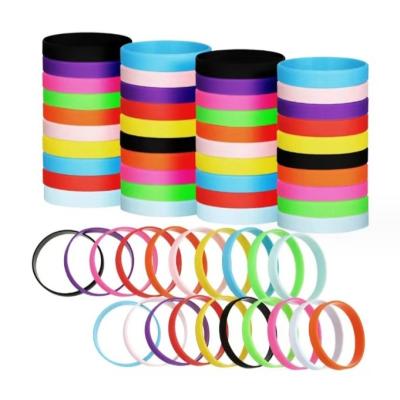 China Cutting Processing Service Glowing Silicone Wristbands with Customized Design and Logo for sale