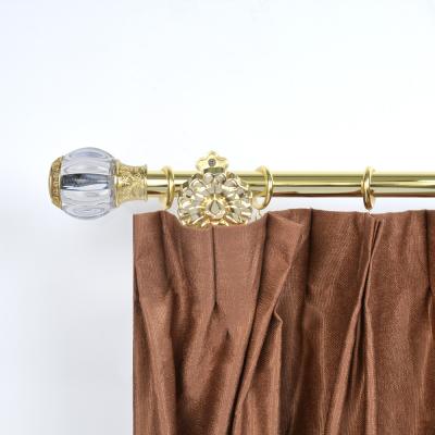 中国 家の装飾28MMの管のカーテン・レールの現代金色のカーテンのポーランド人の水晶カーテンのFinials 販売のため