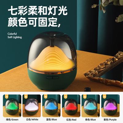 中国 600ml卸し売り装飾的な無線木製の穀物の超音波香料入りの精油部屋の香りの拡散器多彩なLEDのライト 販売のため