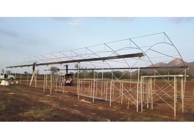 Greenhouse installation process showing modular components