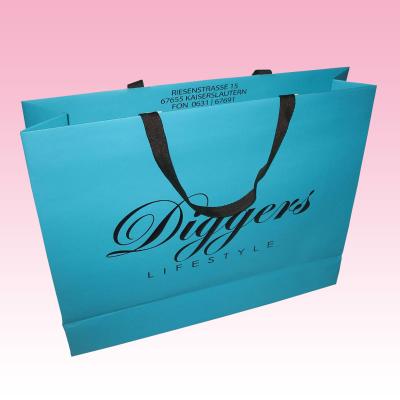 fabricante personalizado de impresión de bolsas de papel azul para mercancías a todo color