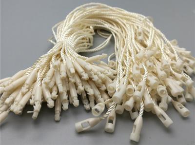 China custom cheap beige cream-coloured plastic seal String hang tag with bullet clasp for sale