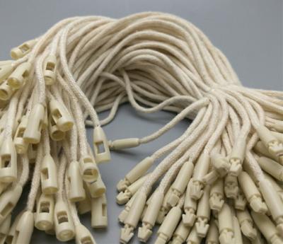 China custom cheap beige cream-coloured plastic seal String hang tag with bullet clasp for sale