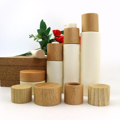 China Botellas cosméticas redondas personalizadas con tapa sin derrames Botellas de crema tapa de madera en venta