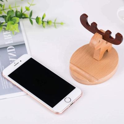 China Suporte de telefone celular de madeira natural, porta-smartphone ecológico, base de telefone celular de escritório de veado de desenhos animados for sale