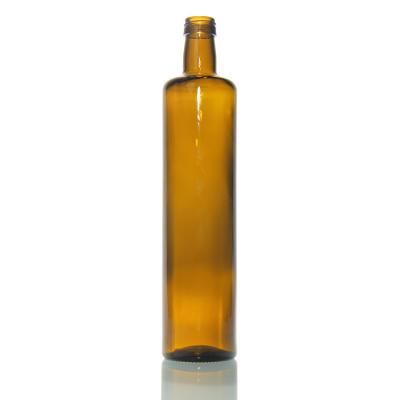 China Container de garrafa de azeite de vidro verde ODM com cabeça de bomba 17oz à venda