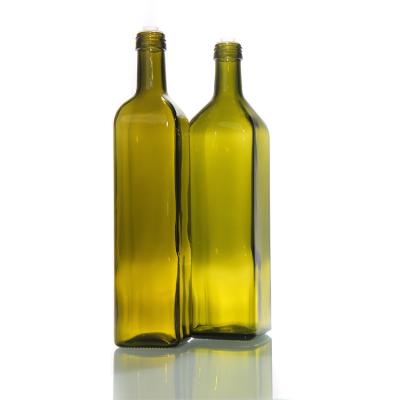 China Container de garrafa de azeite de vidro verde ODM com cabeça de bomba 17oz à venda