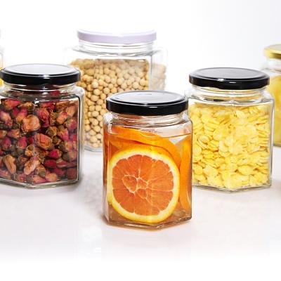 Cina Bottine di vetro a sottaceti esagonali per pasta Bottine di vetro per alimenti quadrati Bottine di stoccaggio 16 oz in vendita