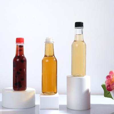 China 5oz 150ml Round Hot Sauce Bottles Glass Chili Sauce Bottle for sale