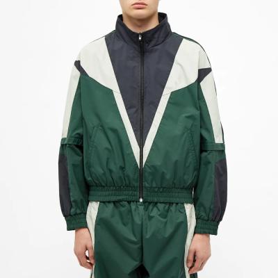 Cina Disposizioni con elastico del Colorblock degli uomini su ordinazione della giacca a vento di 100% del rivestimento di nylon della pista in vendita
