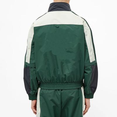 Cina Disposizioni con elastico del Colorblock degli uomini su ordinazione della giacca a vento di 100% del rivestimento di nylon della pista in vendita