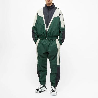Cina Disposizioni con elastico del Colorblock degli uomini su ordinazione della giacca a vento di 100% del rivestimento di nylon della pista in vendita