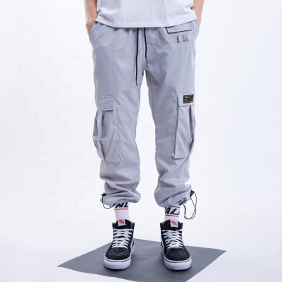 Cina Pantaloni correre di nylon dei pareggiatori impermeabili degli abiti sportivi della giacca a vento in vendita