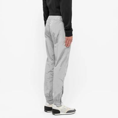 Cina Pantaloni di nylon affusolati della giacca a vento degli uomini dei pareggiatori degli abiti sportivi dello zip adatto della caviglia con le chiusure lampo in vendita