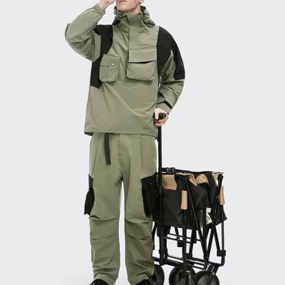 Cina Gli sport correnti tessuti impermeabili del vento seguono i rivestimenti che il multi maschio della tasca tricotta il rivestimento del carico in vendita