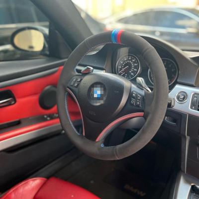Cina Copertura del volante cucita a mano con filo nero per BMW E90 E91 E92 E93 E87 E81 E82 E88 X1 E84 in vendita