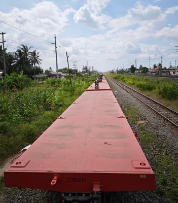 China Coil Spring Suspensiontype Railway Flat Wagon Engineered for Large Goods Payload 61t 2 TEU Robust Rail Freight Transport for sale