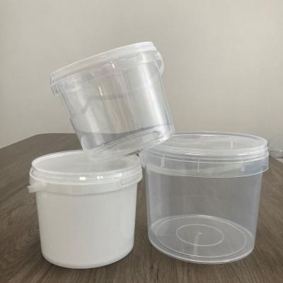 Cina Barattolo di caramelle durevole da 1 litro Barattolo di popcorn di plastica stampato da 32 oz con coperchio e maniglia in vendita