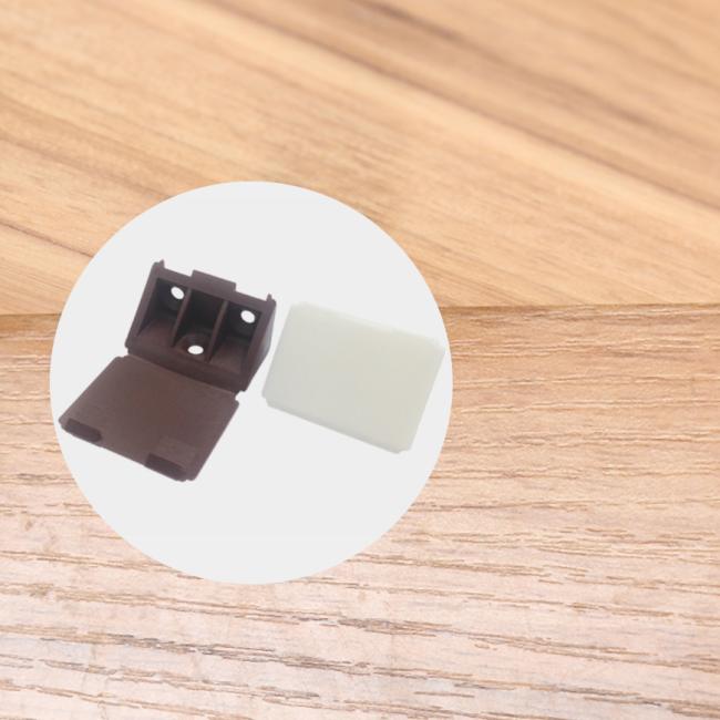 Multiple plastic angle brackets showing size comparison
