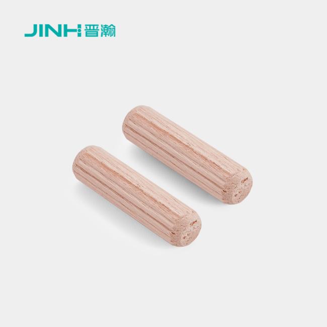 Close-up view of JINHAN wooden dowel pins showing fluted design