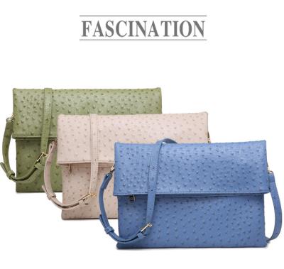 China 2023 cheap popular serpentine envelope clutch  messenger bag for sale