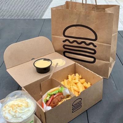 中国 カスタムプリントテイクアウトフライドチキンバーガーペーパーボックスフィッシュアンドチップスフライドポテトストリートスナックフード包装箱ファストフード用 販売のため